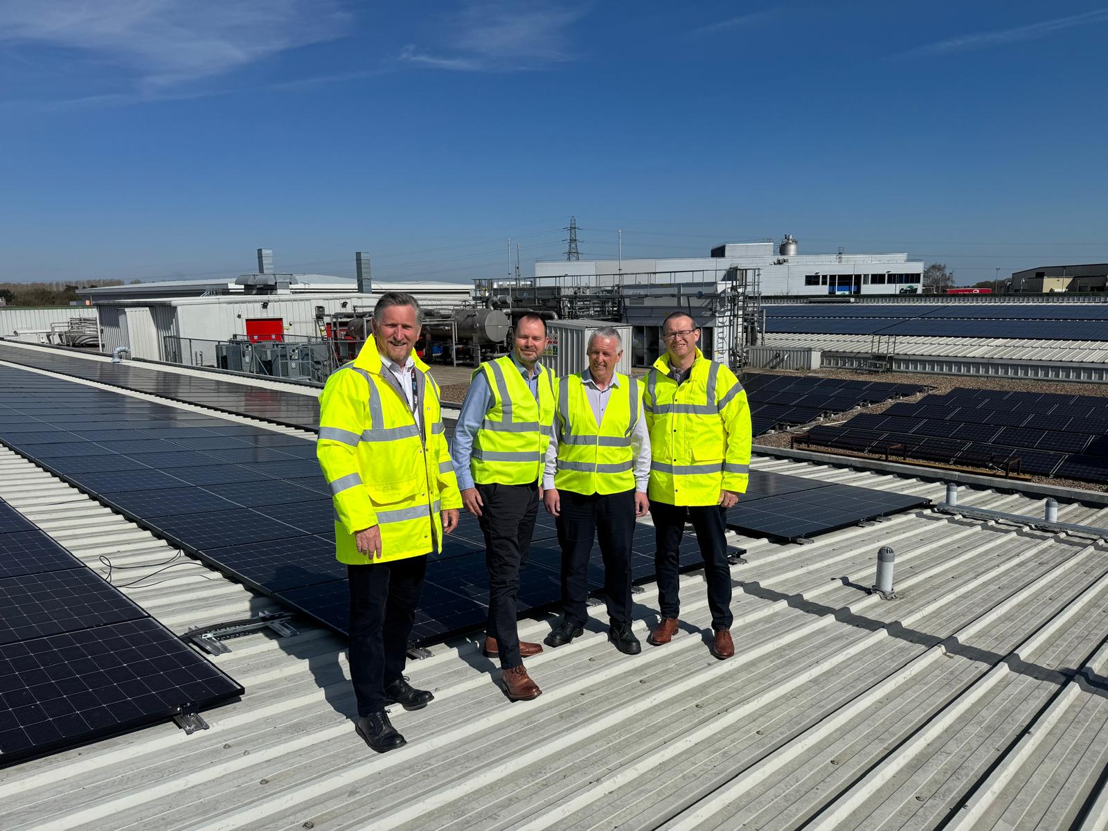 Greencore team with solar panels - Greencore